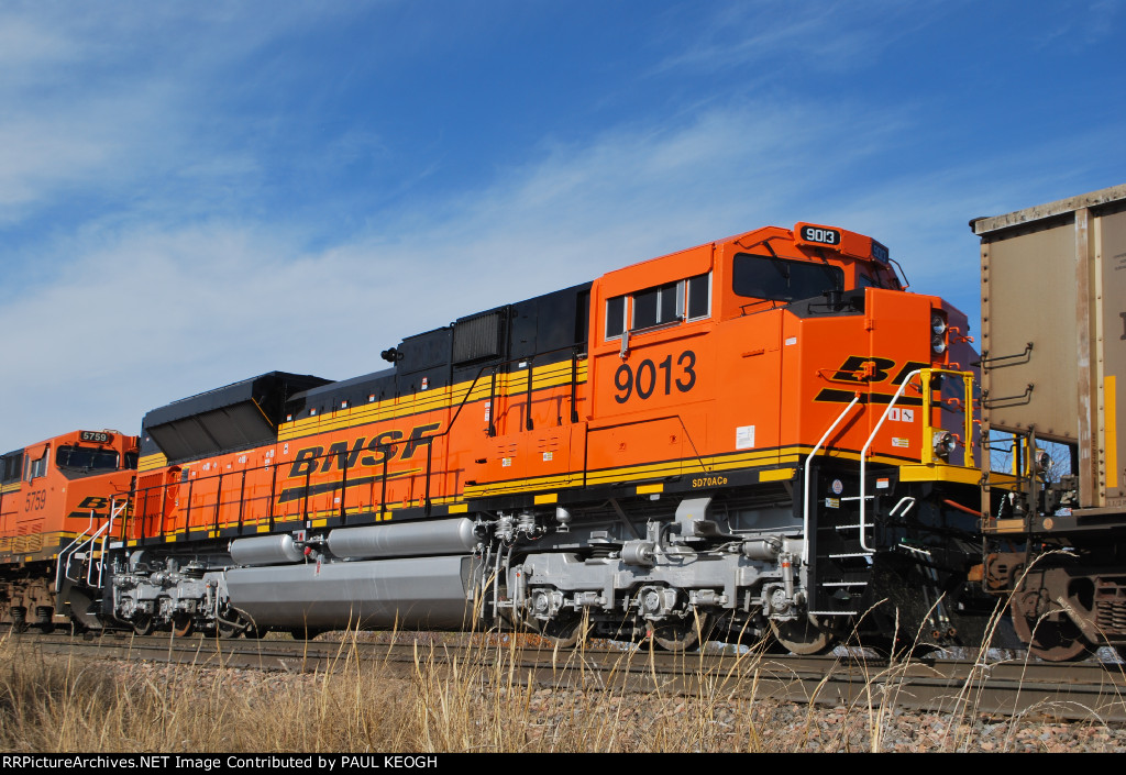 BNSF 9013 sits on the Main line just west of BNSF Creston, Iowa as the #3 unit on a Empty ...